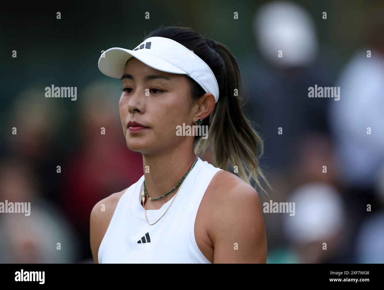 London, Britain. 1st July, 2024. Wang Qiang reacts during the women's singles first round match ...