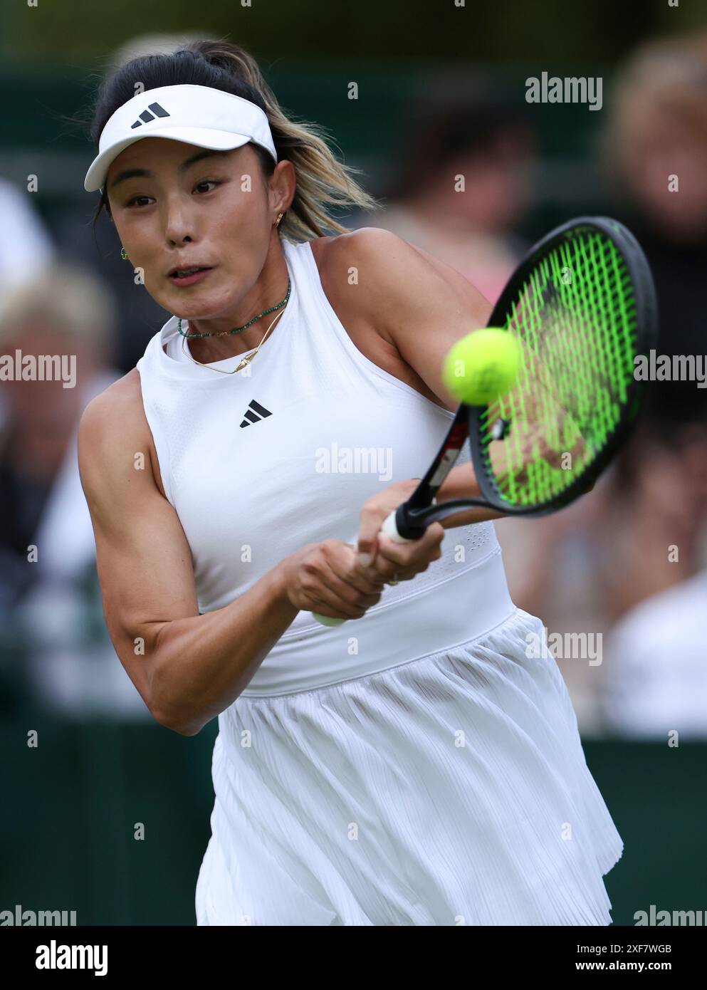 London, Britain. 1st July, 2024. Wang Qiang hits a return during the ...