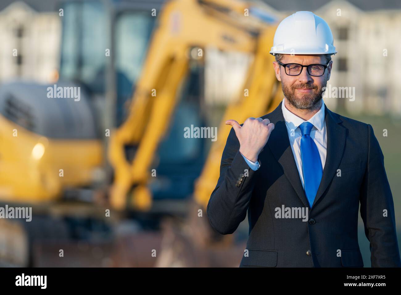 Successful construction business owner. Construction worker in suit and ...