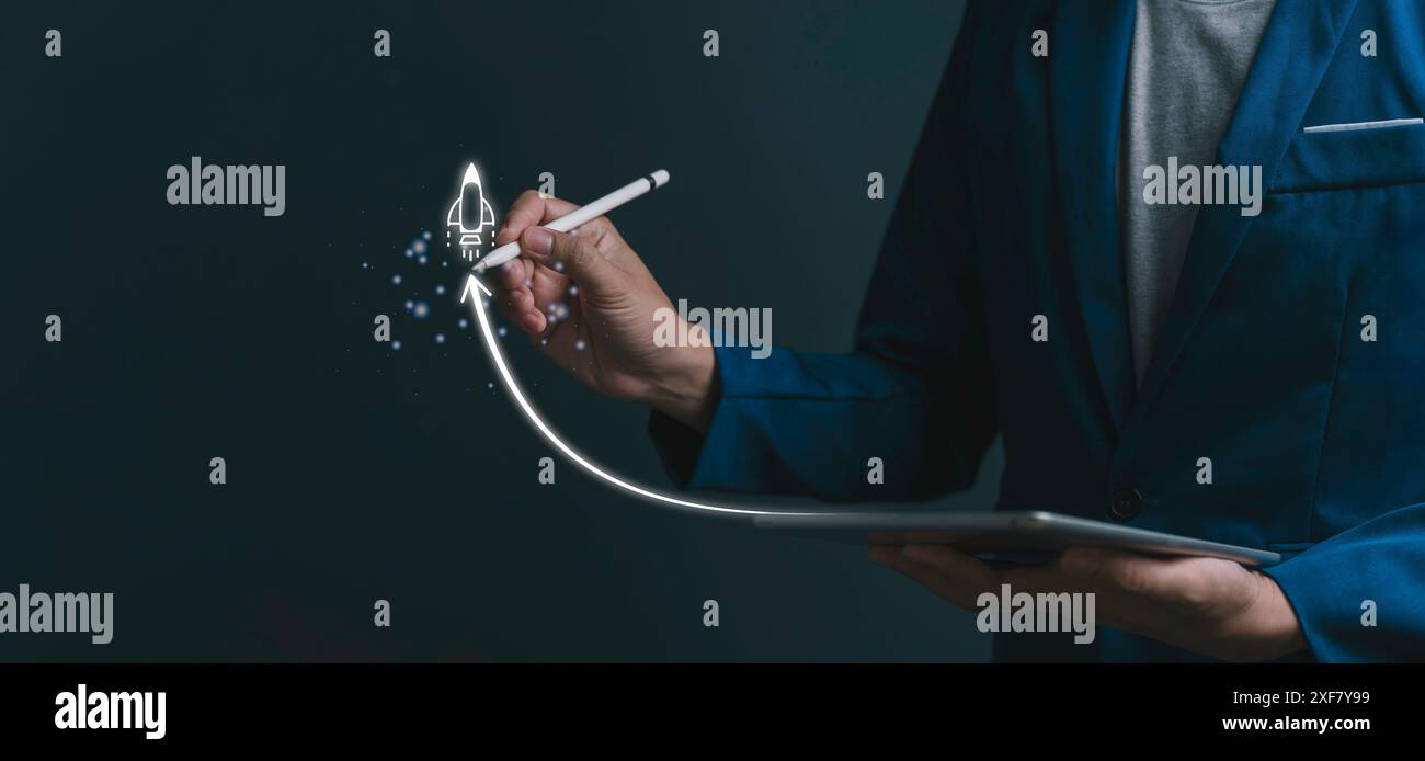 Startup business concept, Businessman and icon rocket and arrow is ...