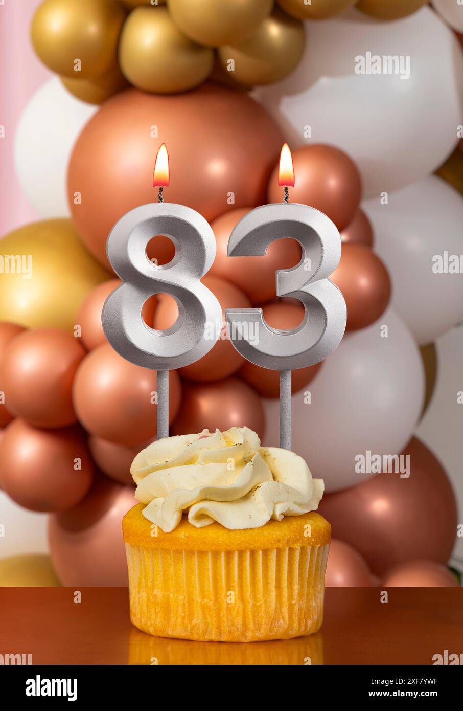Cupcake with birthday candle on balloons background - Number 83 Stock ...