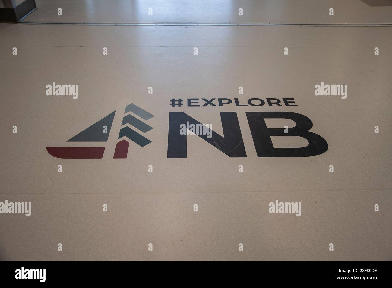 Explore NBS sign on the floor inside the Fredericton International ...
