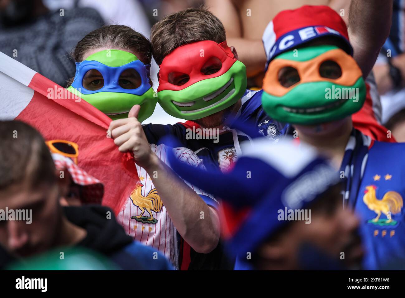 Duesseldorf. 1st July, 2024. Fans of France wearing masks imitating ...