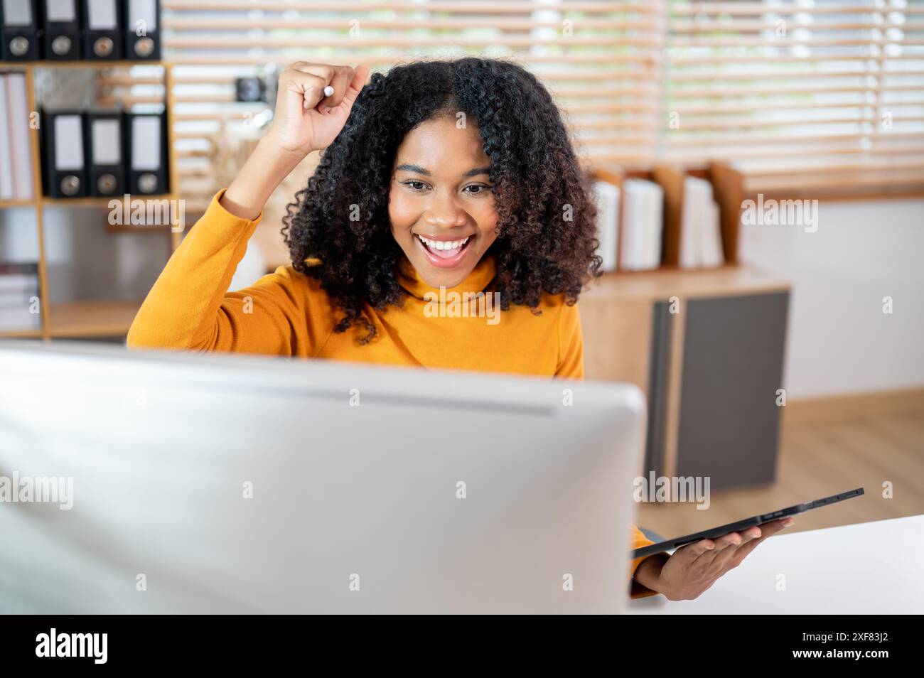 Black woman computer fist hi-res stock photography and images - Alamy