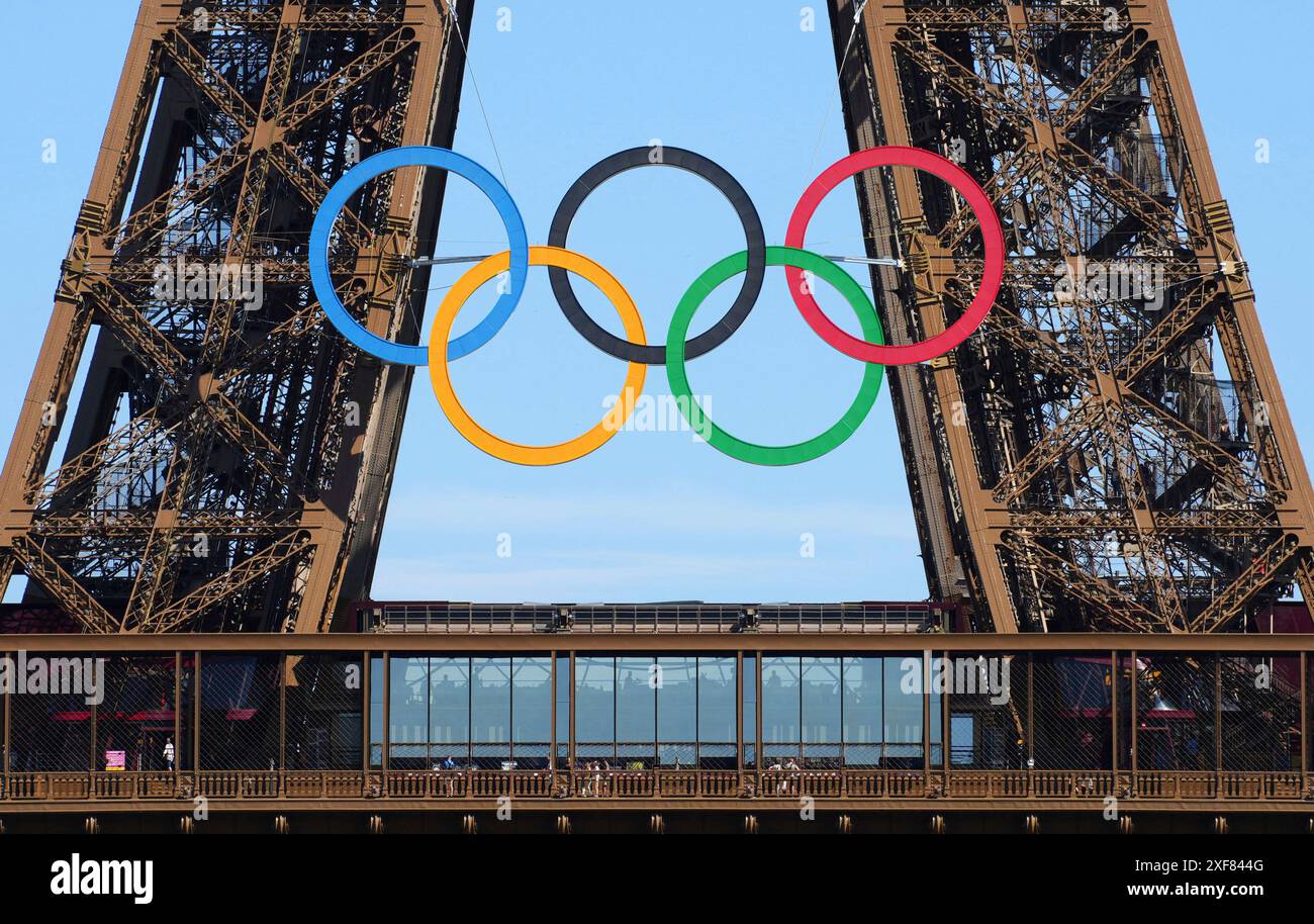 The Olympic five rings mounted on the Eiffel Tower is seen in Paris ...