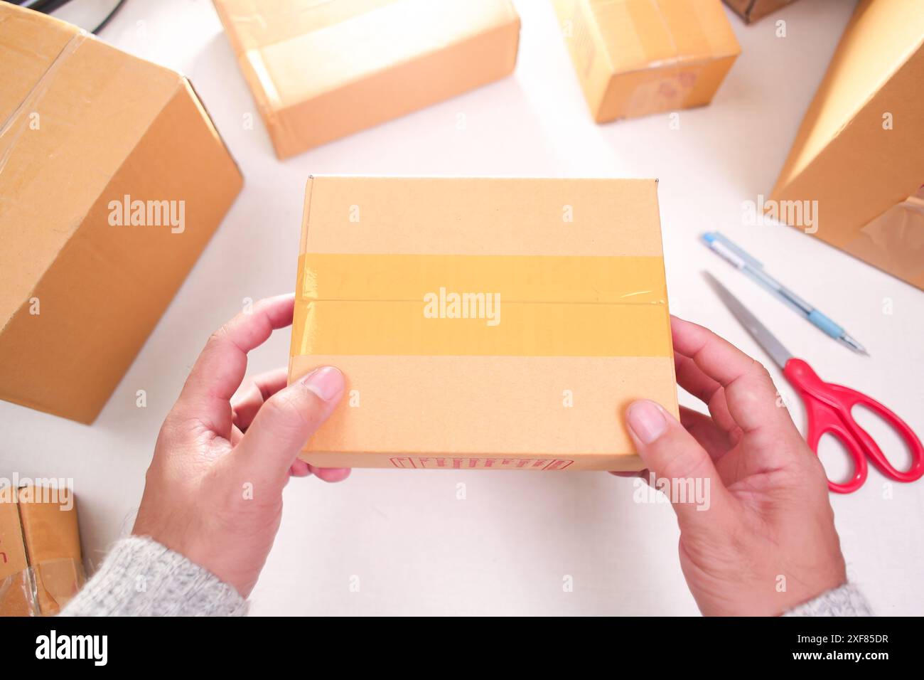 Goods delivery concept , human hand carrying a goods box and cardboard ...