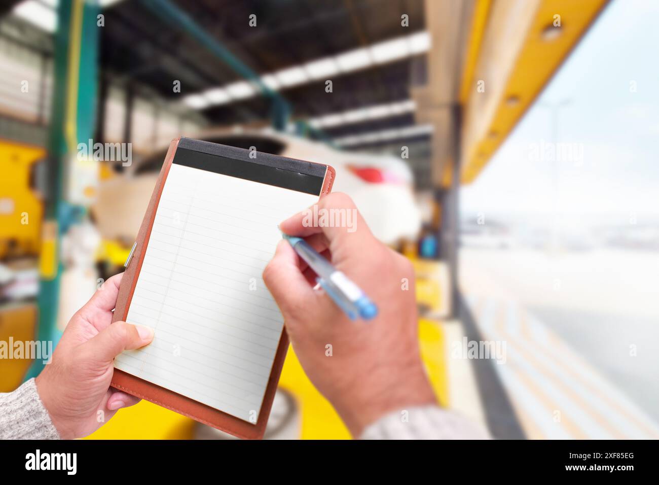 Car maintenance service concept , Blank book in a hand of officer to ...