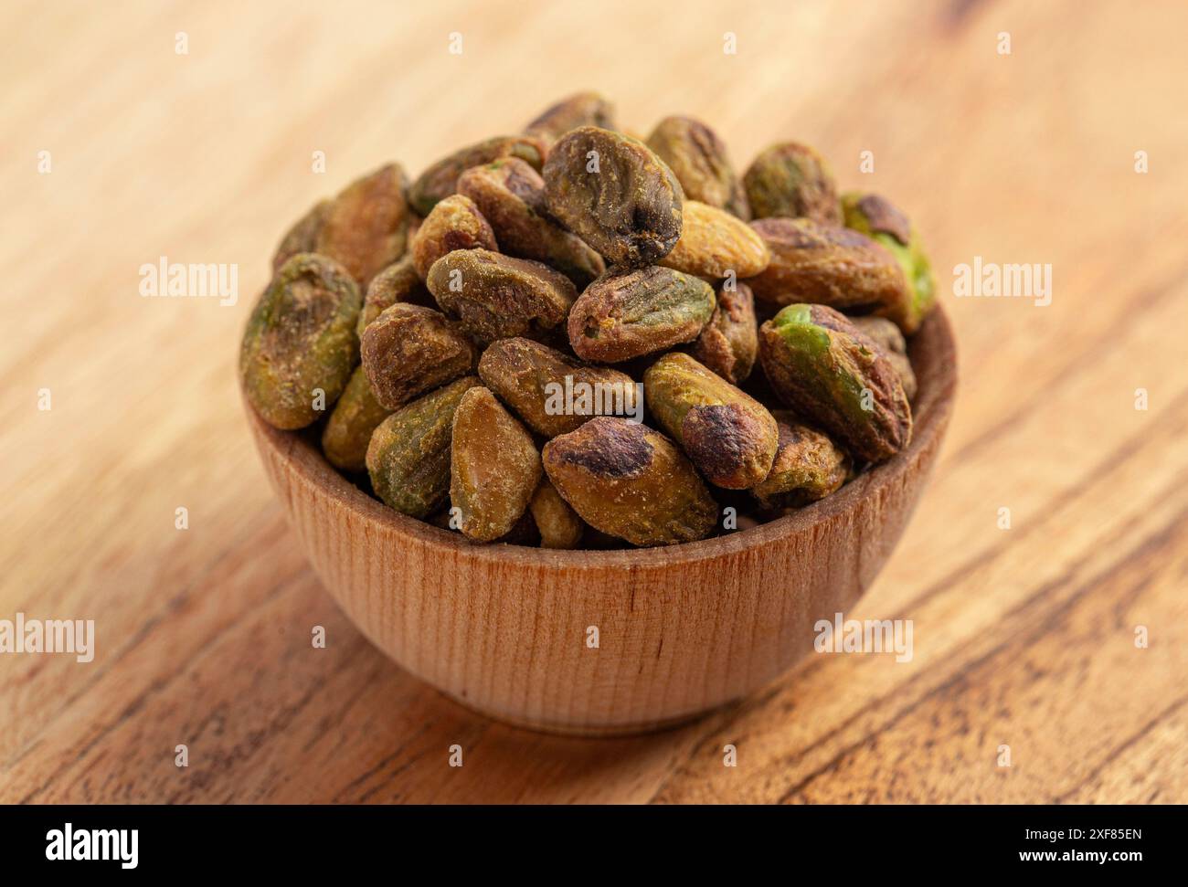 Roasted and Salted Pistachios without Shells on a Wood Table Stock ...