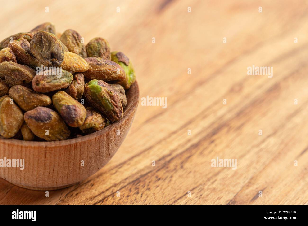Roasted and Salted Pistachios without Shells on a Wood Table Stock ...
