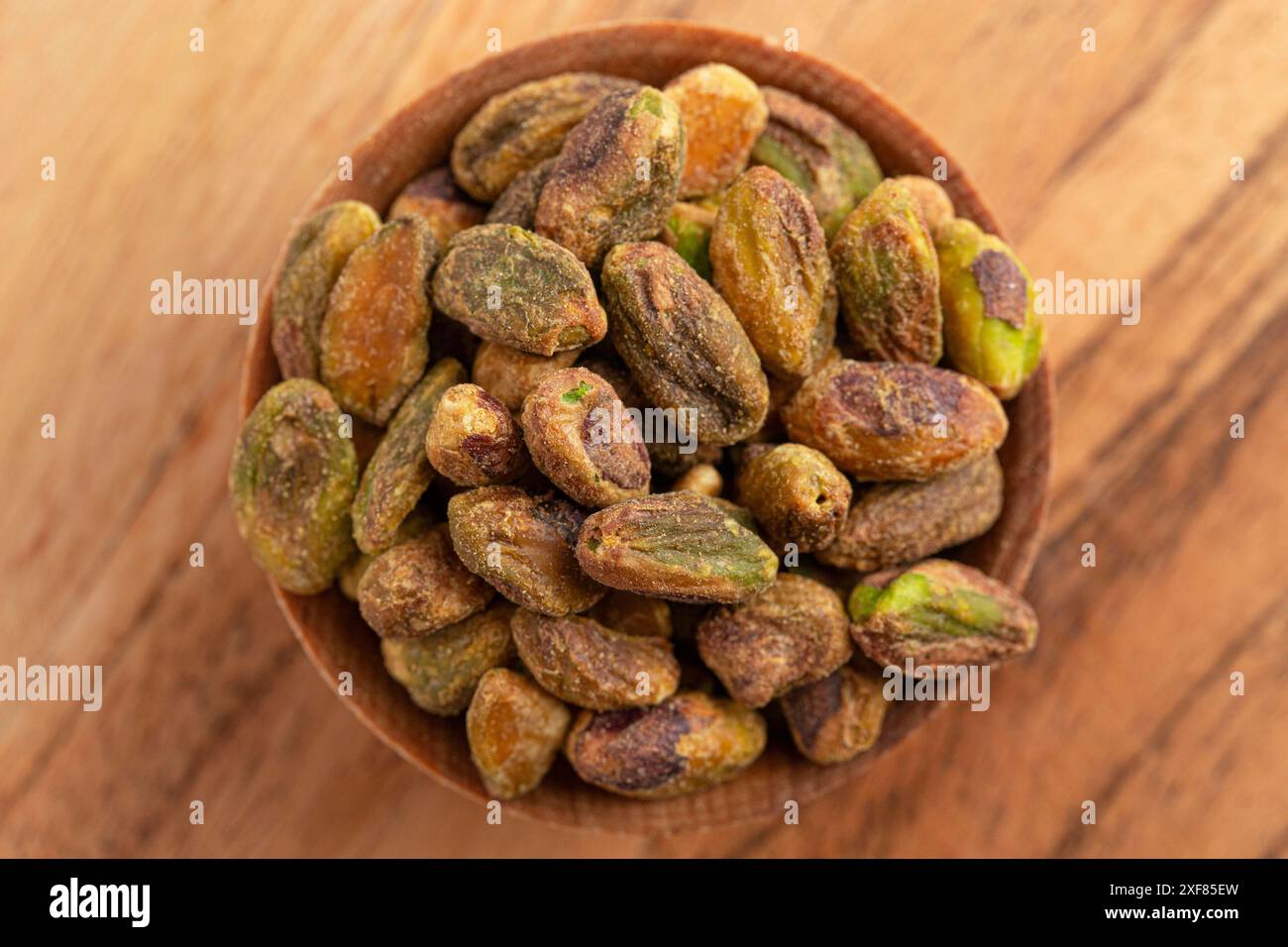 Roasted and Salted Pistachios without Shells on a Wood Table Stock ...