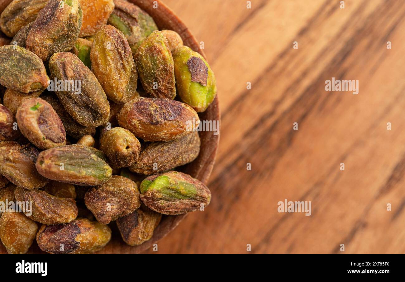 Roasted and Salted Pistachios without Shells on a Wood Table Stock ...