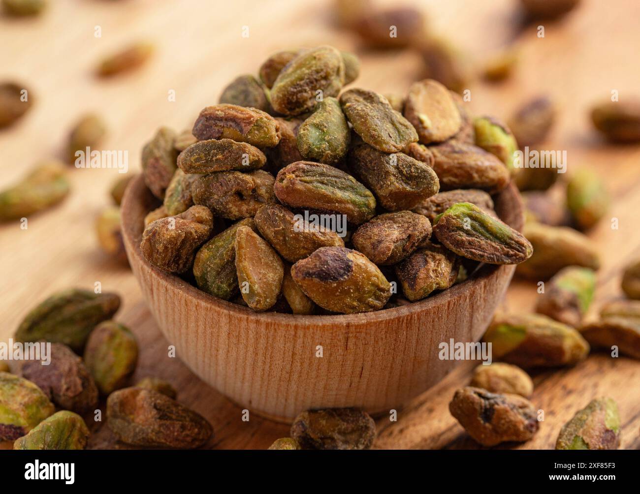 Roasted and Salted Pistachios without Shells on a Wood Table Stock ...