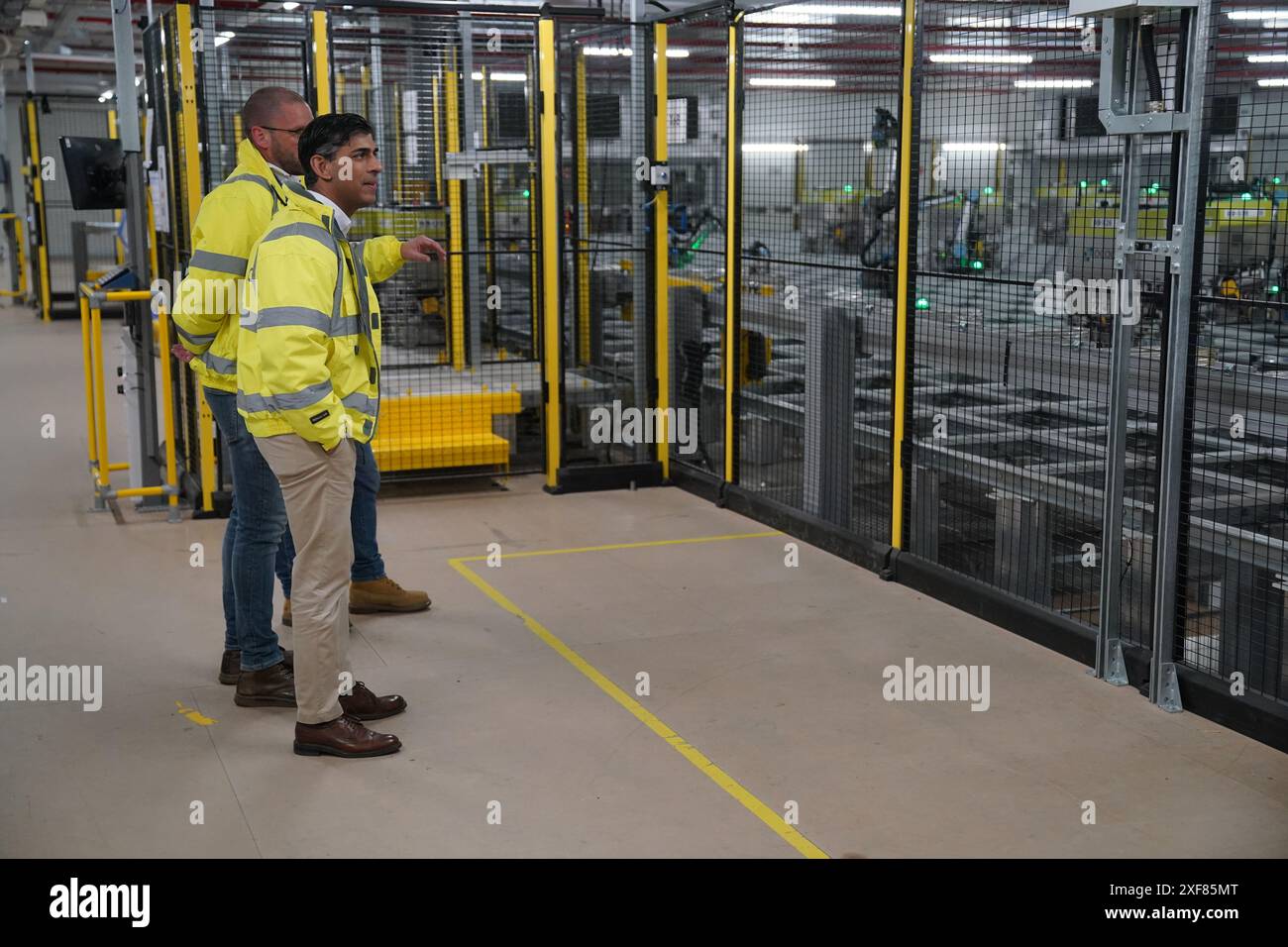 Prime Minister Rishi Sunak during a visit to an Ocado distribution ...