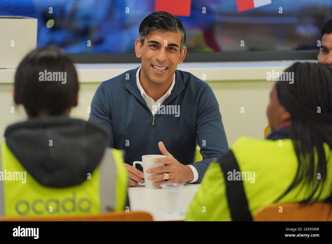 Prime Minister Rishi Sunak during a visit to an Ocado distribution ...