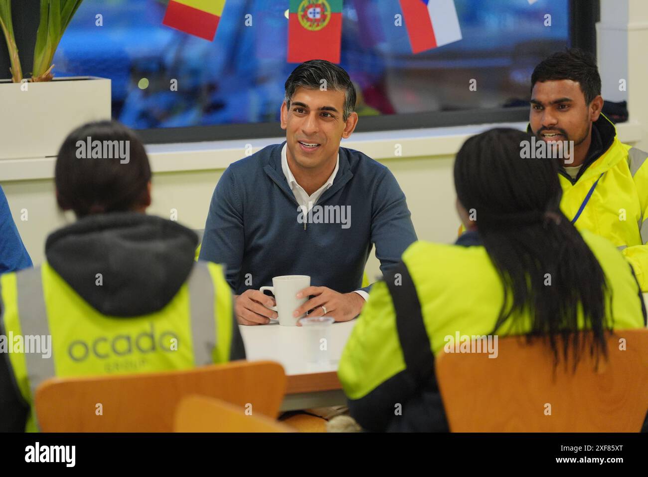 Prime Minister Rishi Sunak during a visit to an Ocado distribution ...