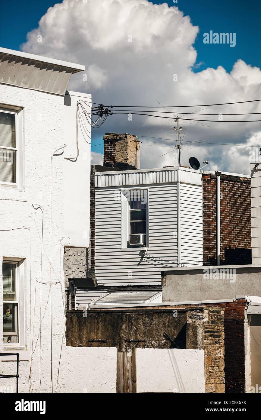 Cityscape with windows of houses against a blue sky with clouds in Port ...