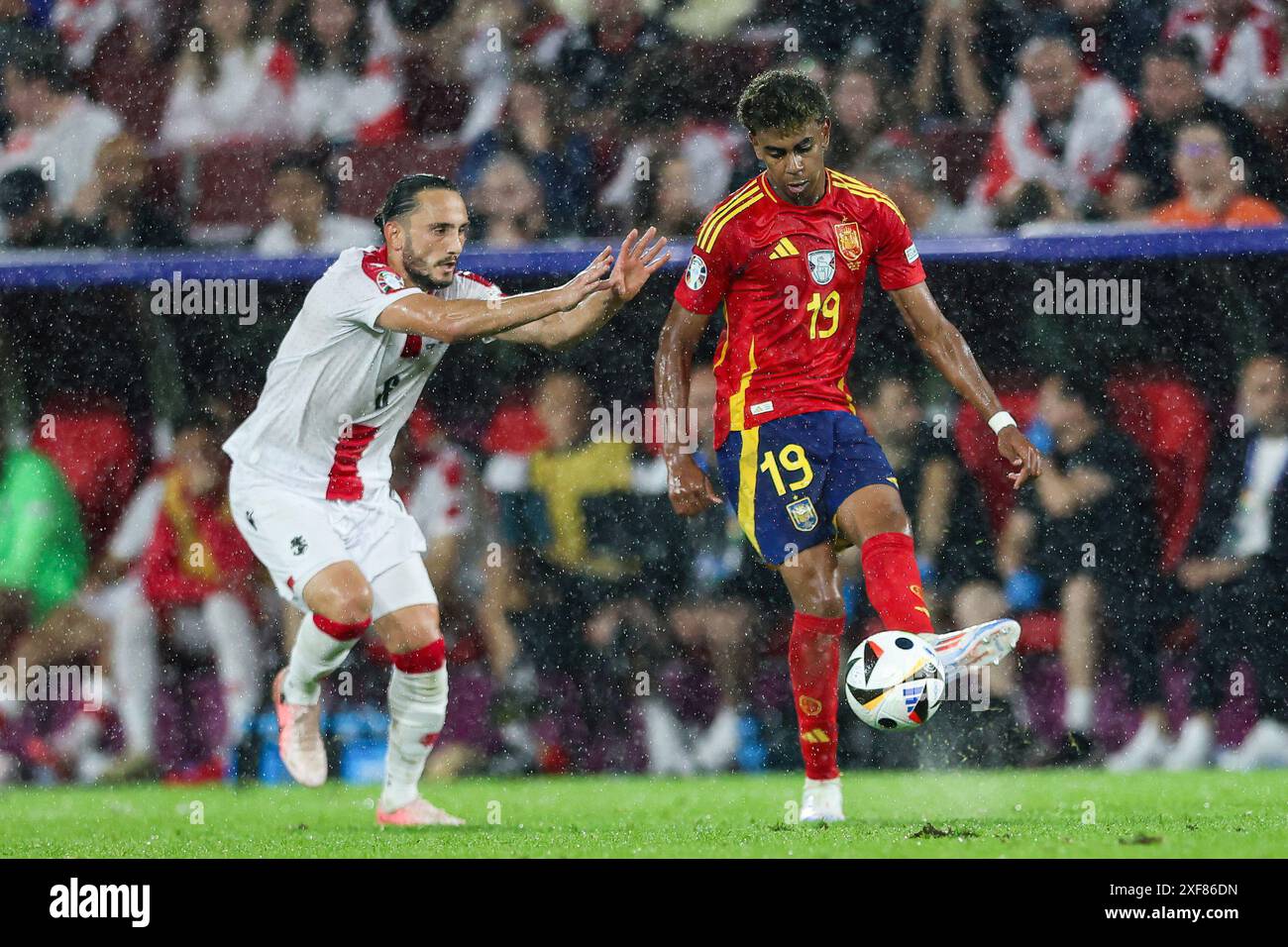Cologne, Germany. 30th June, 2024. Giorgi Kochorashvili of Georgia (L ...