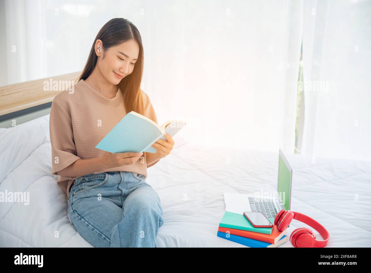 Relax woman holding book read at bookshelf in university library. Young ...