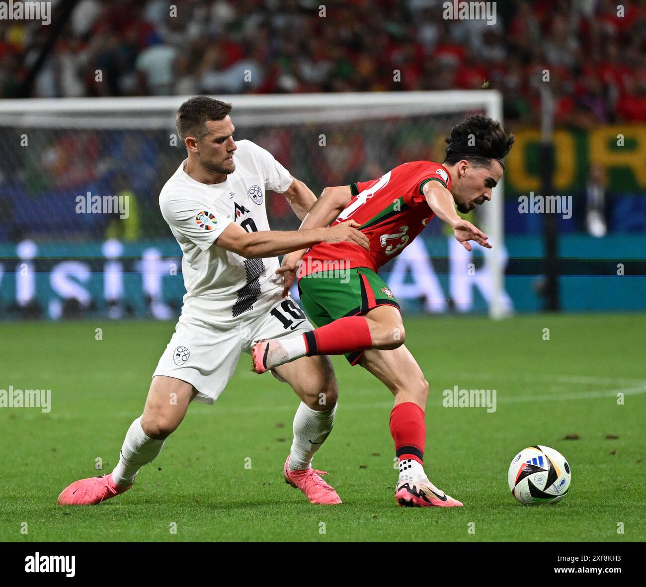 Frankfurt, Germany. 1st July, 2024. Vitinha (R) of Portugal vies with ...