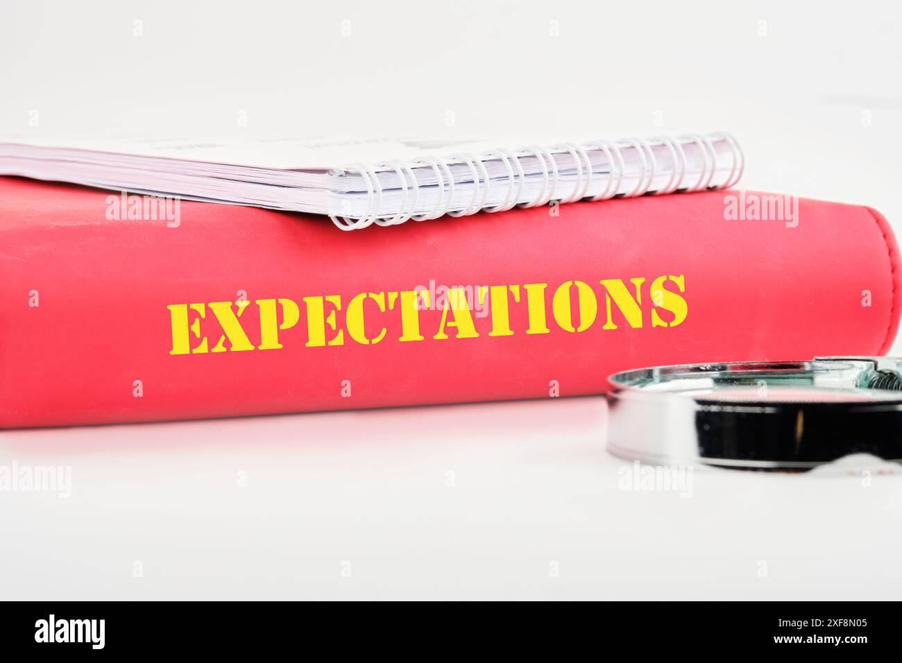 inscription Expectations word on the cover of the book on a white ...