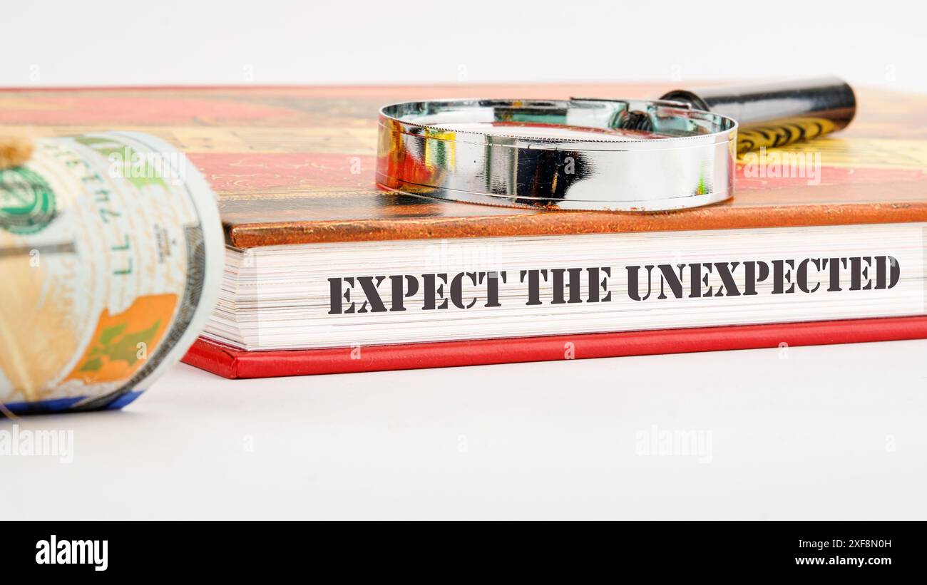Expect The Unexpected word on the end of the book on a white background ...