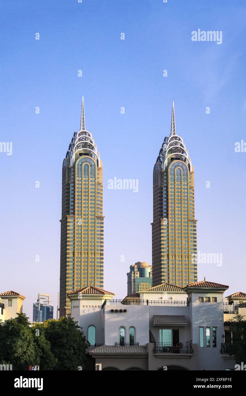 Dubai, UAE - February 23. 2022: The Al Kazim Twin Towers agaist blue ...