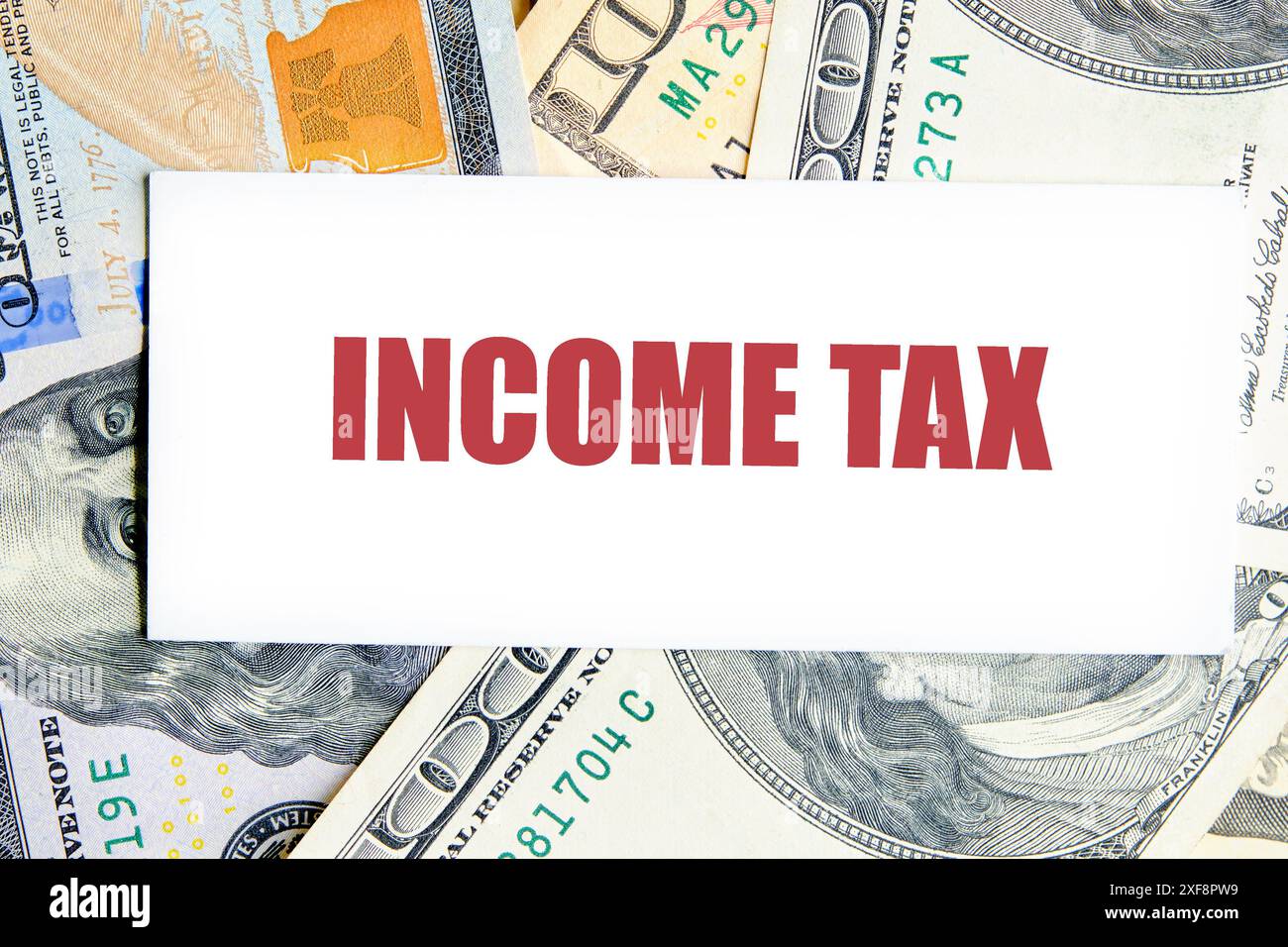 Conceptual income tax symbol. Copy space. Words INCOME TAX on a ...