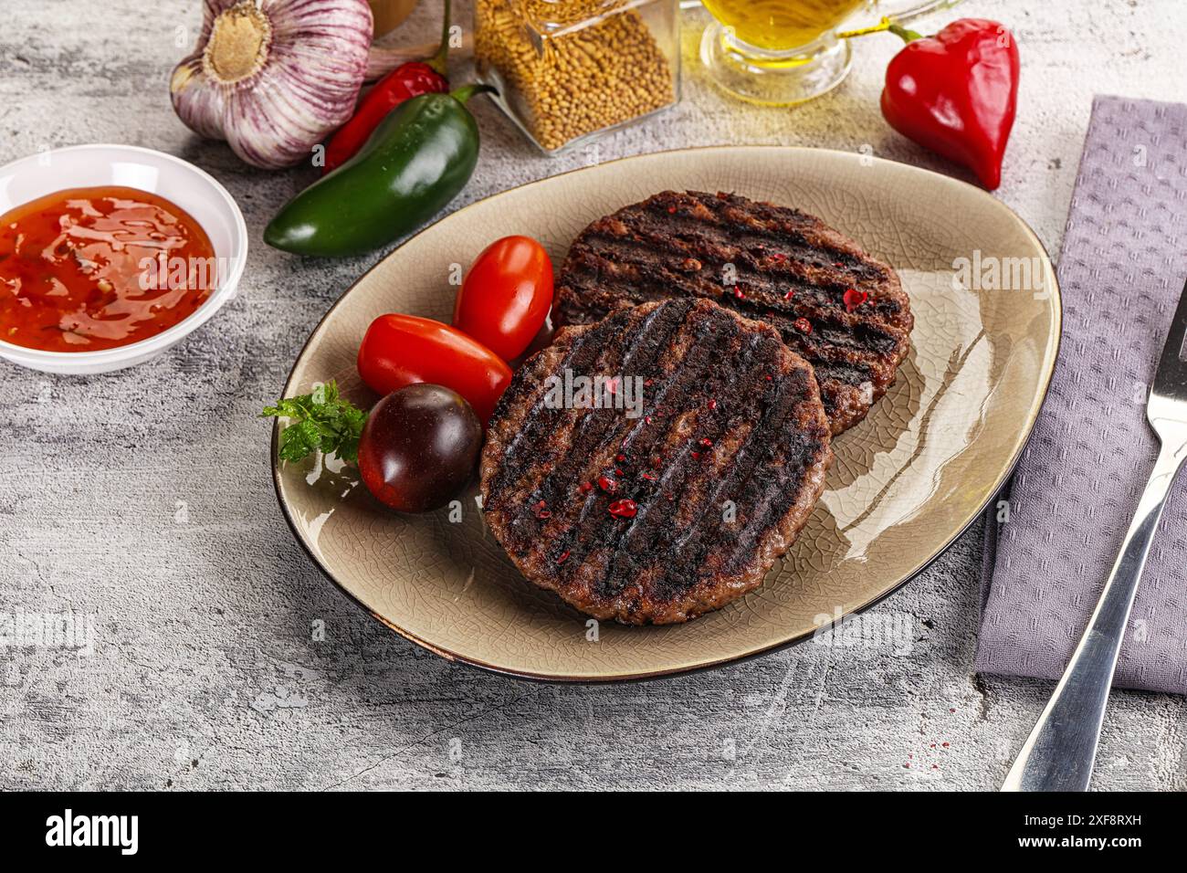 Grilled beef burger cutlet with sauce Stock Photo - Alamy