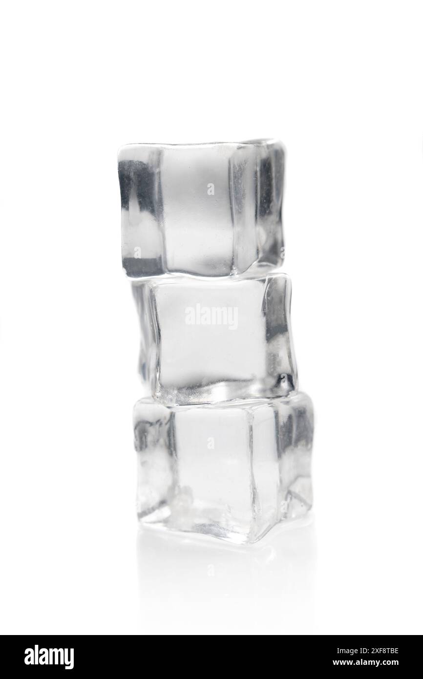 Three ice cubes delicately balanced, creating a stunning tower on a ...