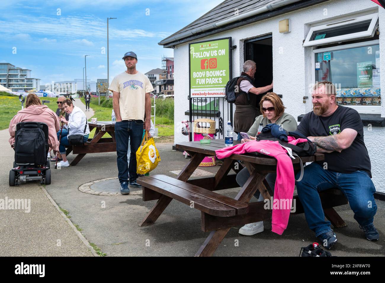 Holidaymakers parents relaxing at picnic tables at the Barrowfields ...