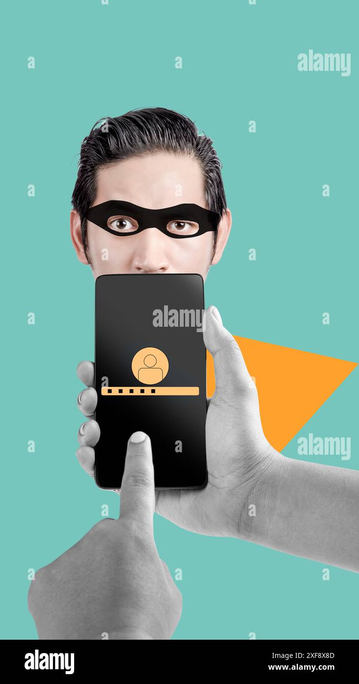 A man face in a mask with a human hand holding a mobile phone with ...