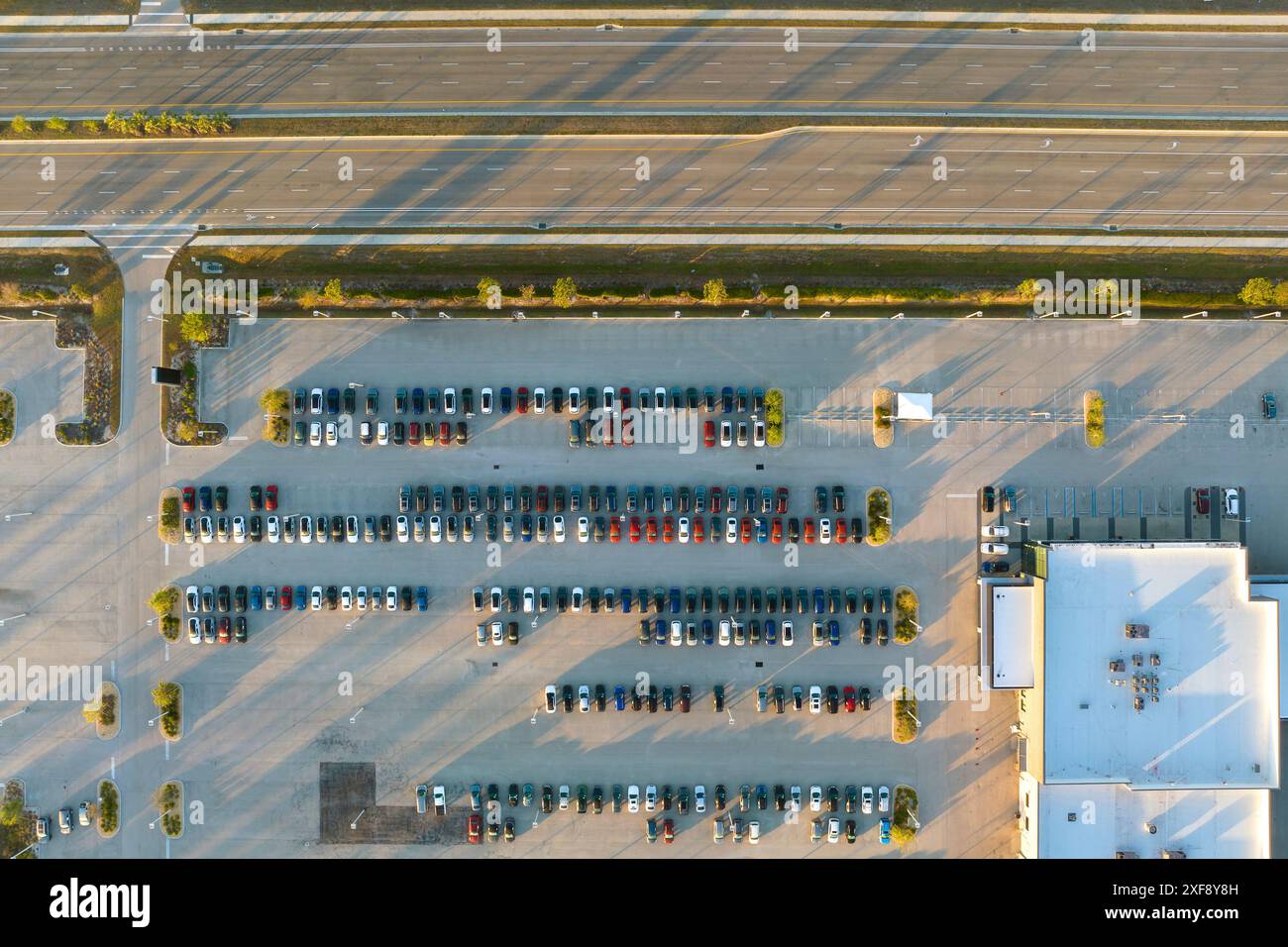 Aerial view of dealership parking lot with many brand new cars for sale ...