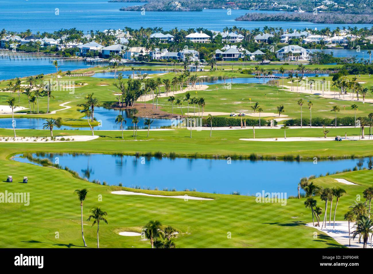 Aerial view of large golf field with green grass in Boca Grande, small ...