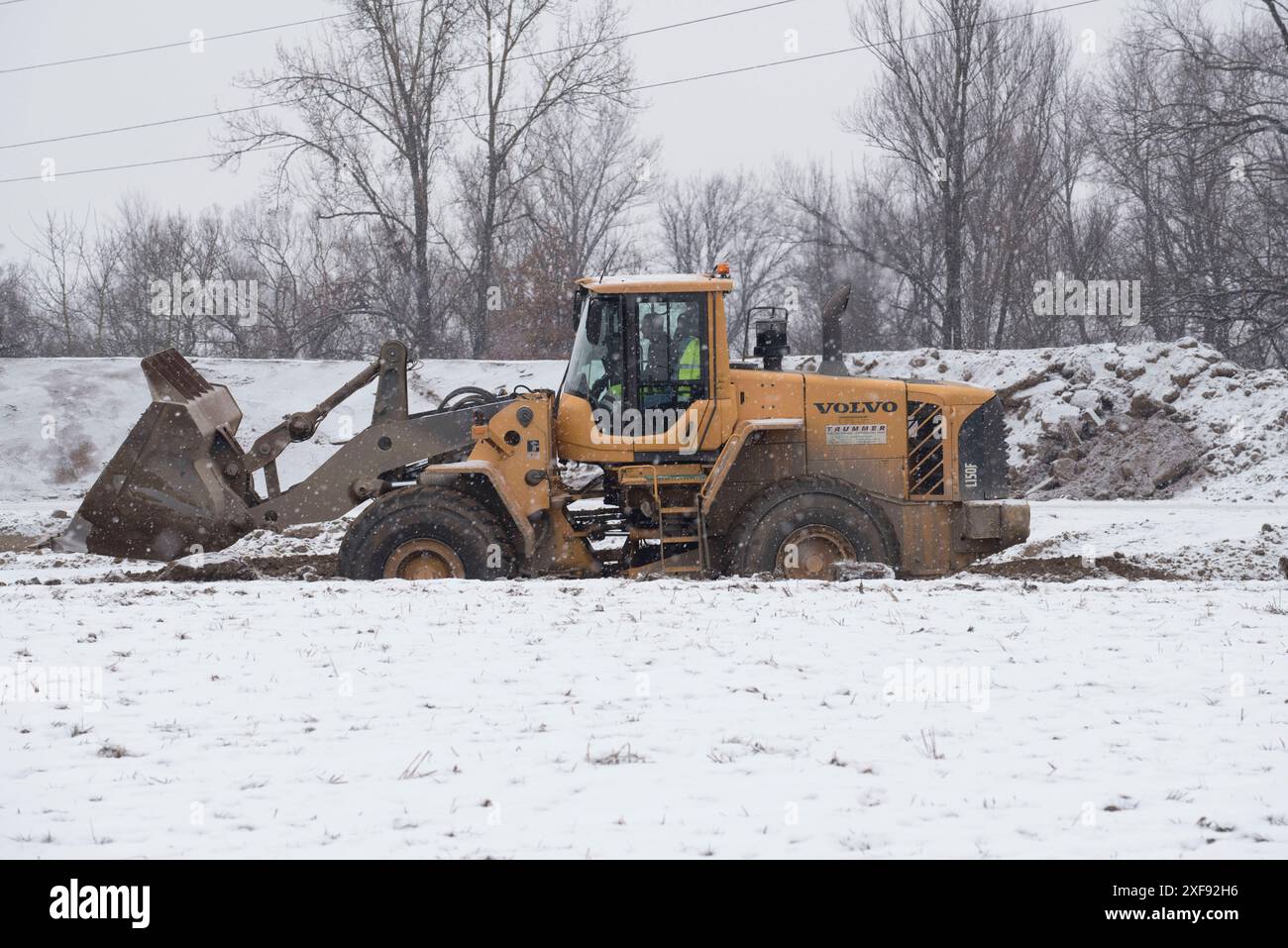 volvo excavator at a construction site, heavy machinery for earthworks ...