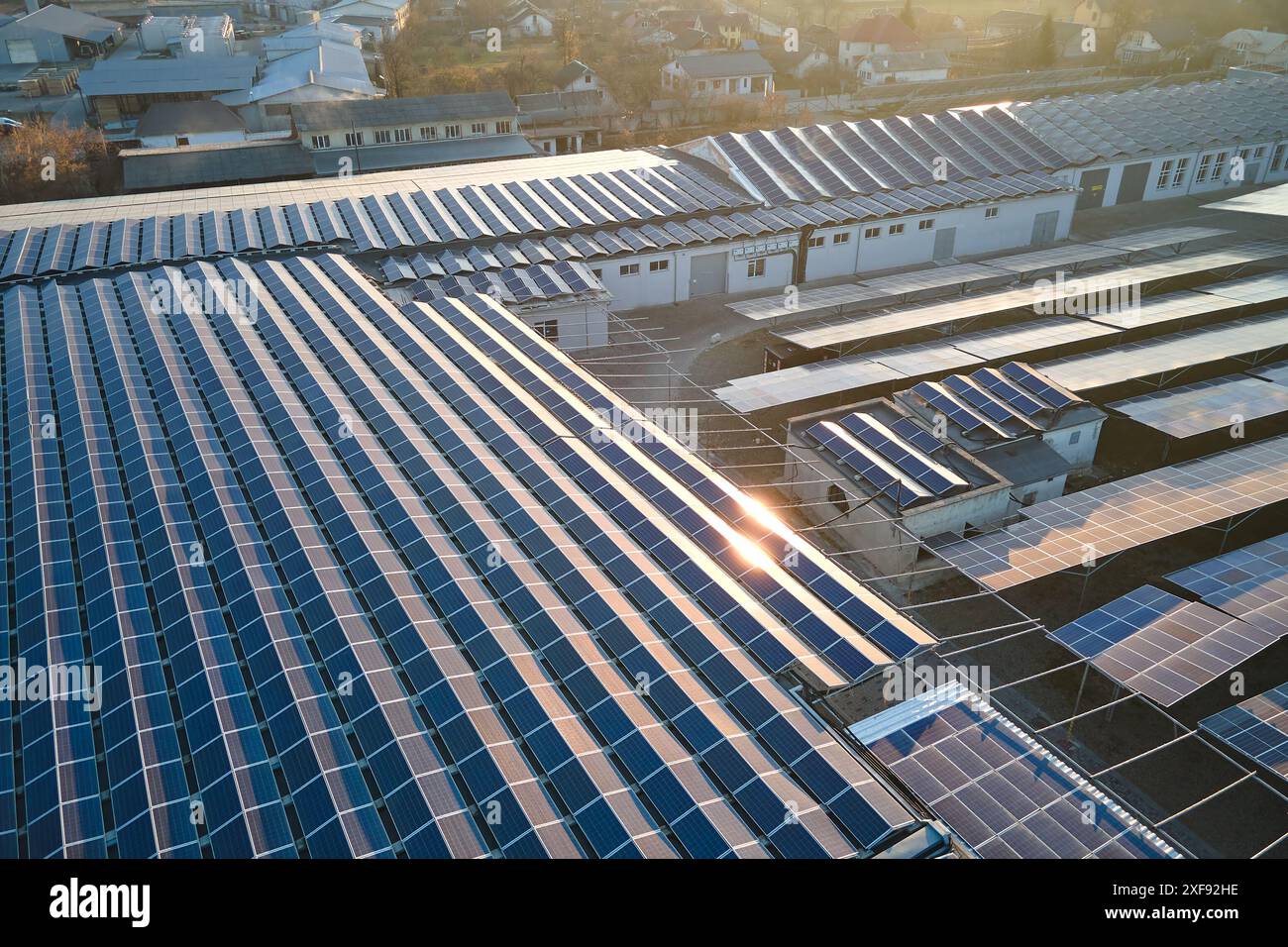 Aerial view of solar power plant with blue photovoltaic panels mounted ...