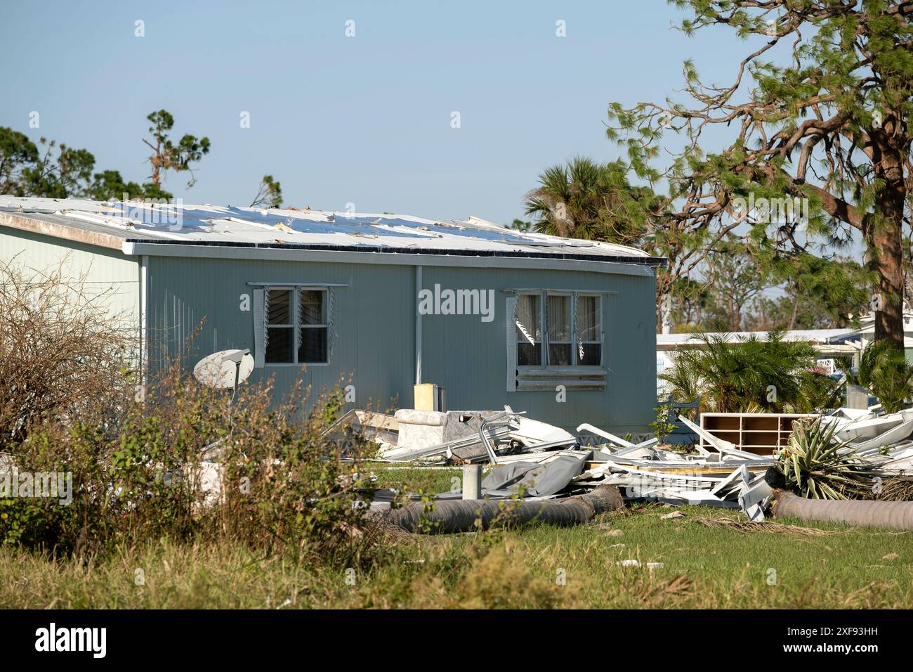 Aftermath of natural disaster in southern Florida. Badly damaged mobile ...