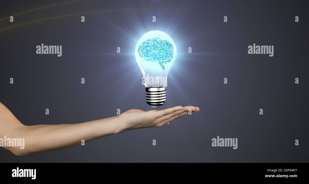 Image of human brain spinning inside a electric bulb over cupped hand ...