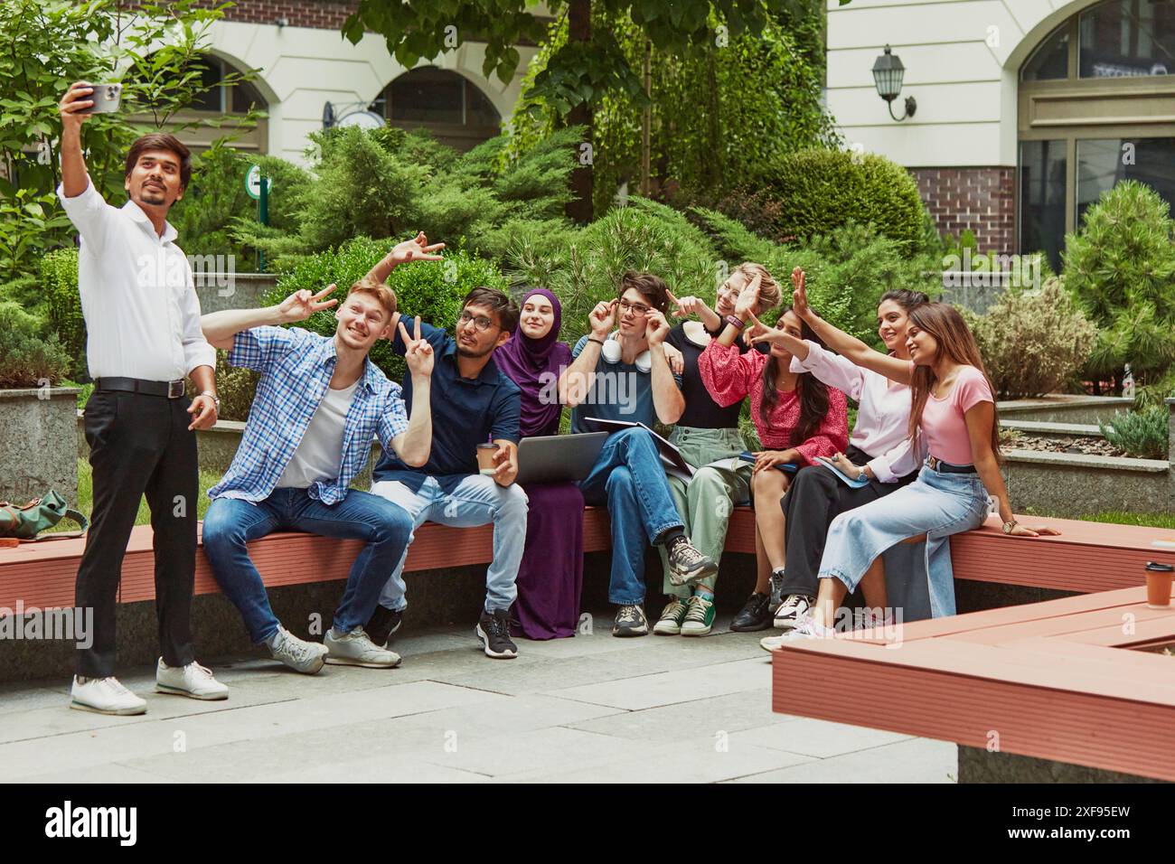 Multiethnic classmates meeting college campus hi-res stock photography ...