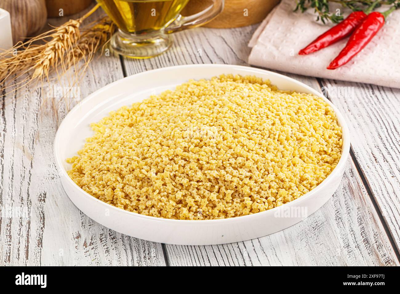 Italian cuisine - dry stelline pasta for bowl Stock Photo - Alamy