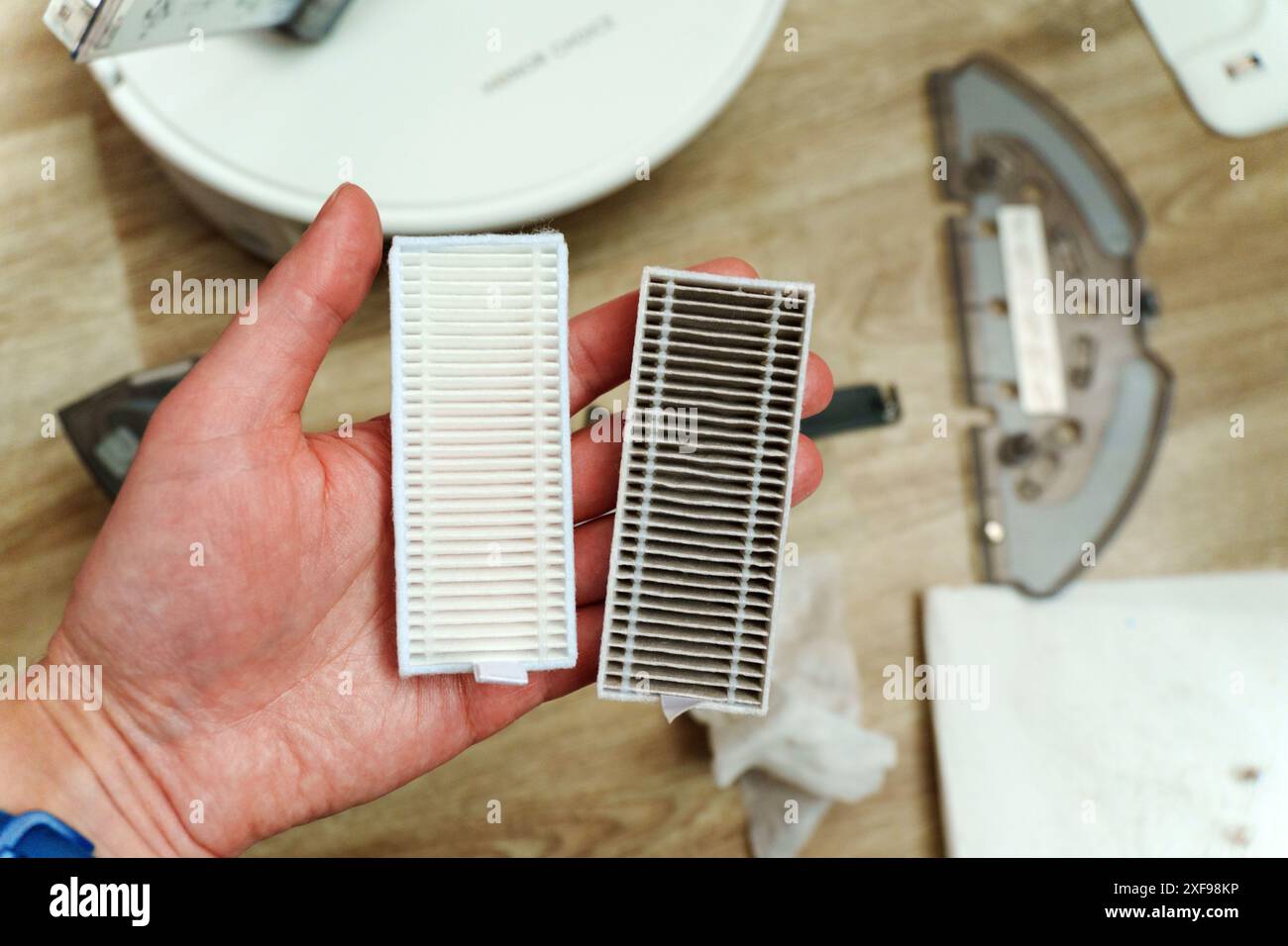 Robot vacuum filters lit home, showcasing the contrast between a ...