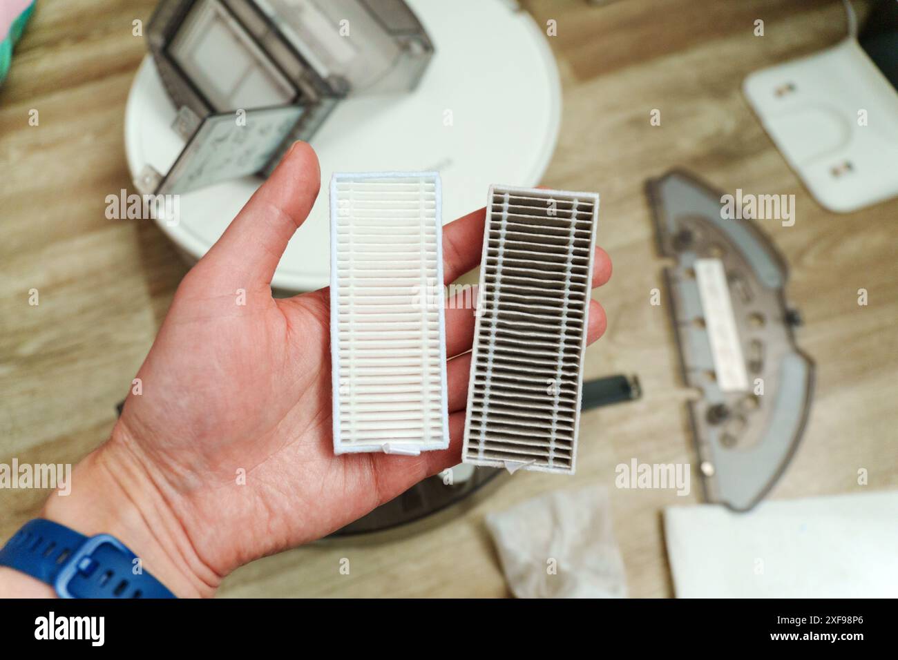 Robot vacuum filters lit home, showcasing the contrast between a ...