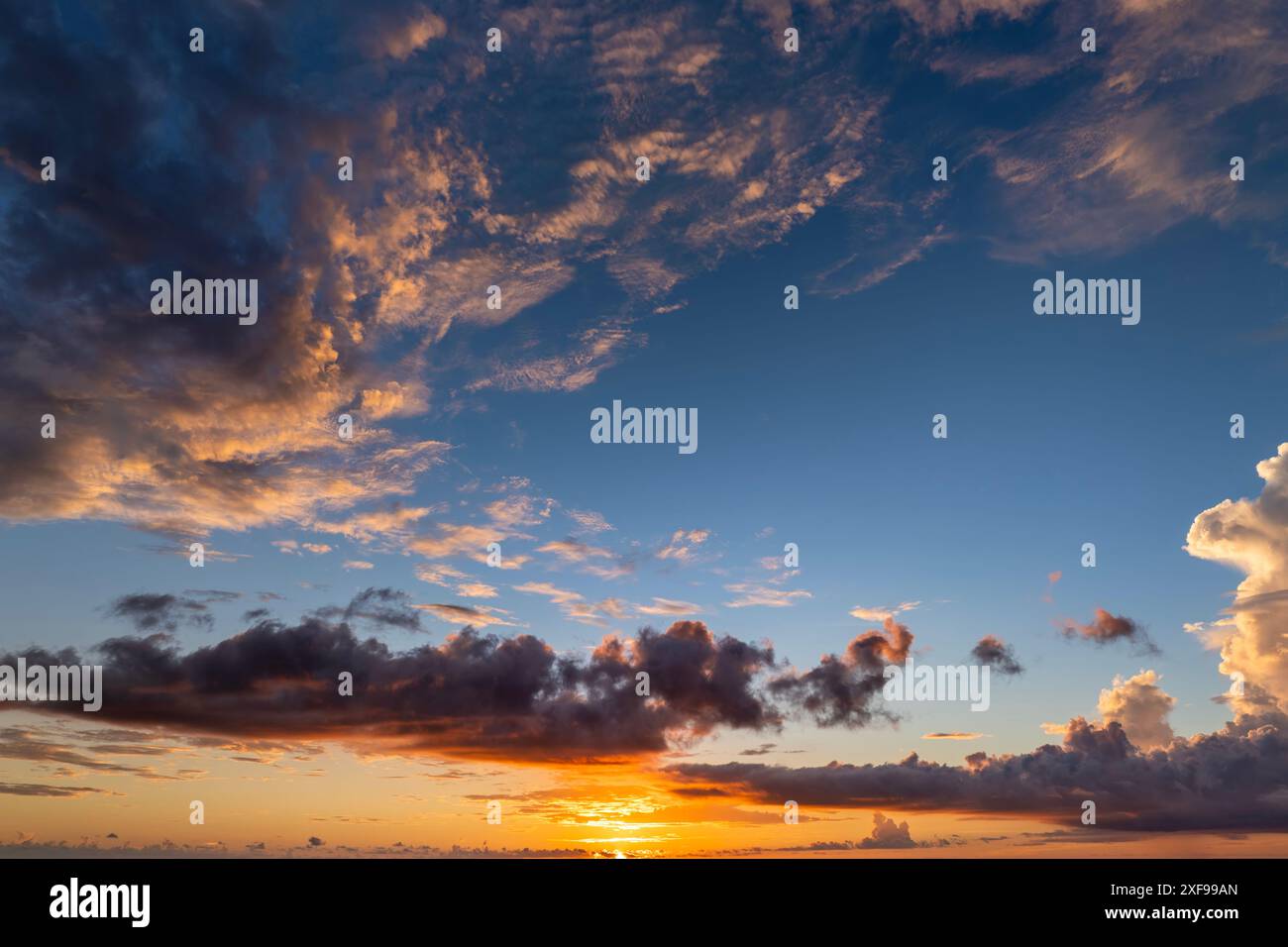 Evening sunset sky with colorful clouds. Panoramic skyscape Stock Photo ...