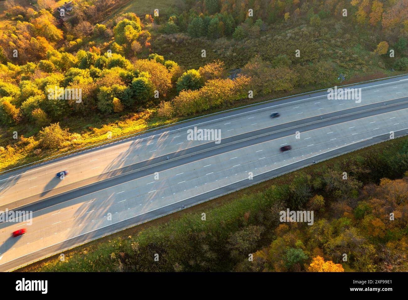 Elevated view of freeway road lanes with fast moving traffic cars and ...