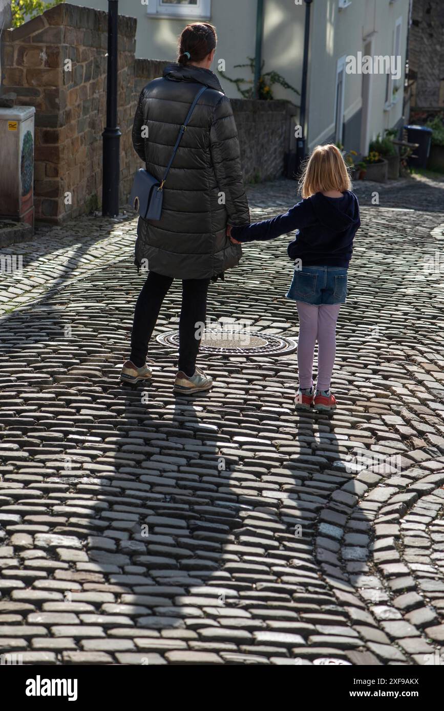 Mother and daughter in the old town centre of Siegen, North Rhine ...