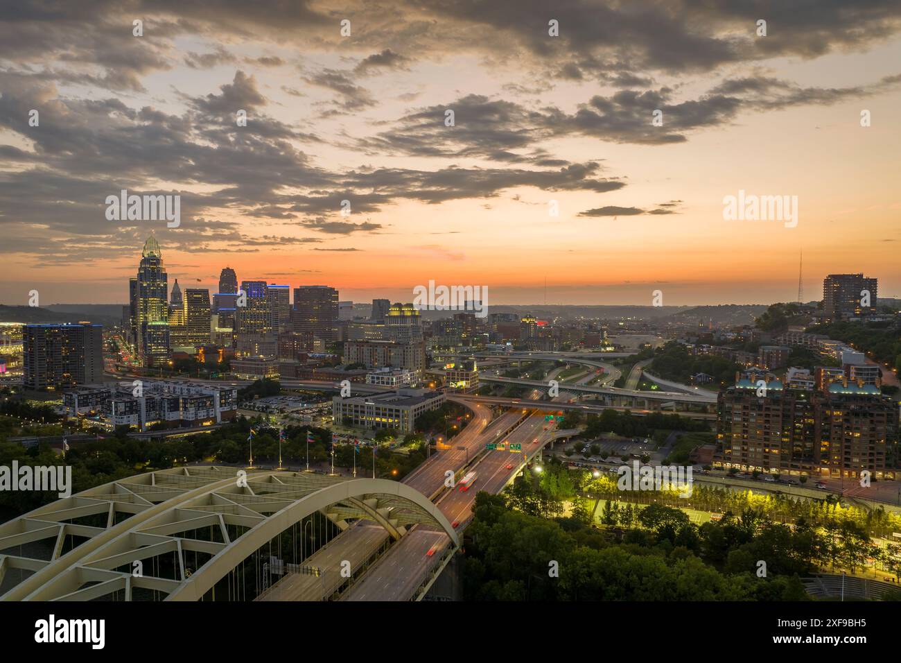 Highway traffic with driving cars on bridge in downtown district of ...