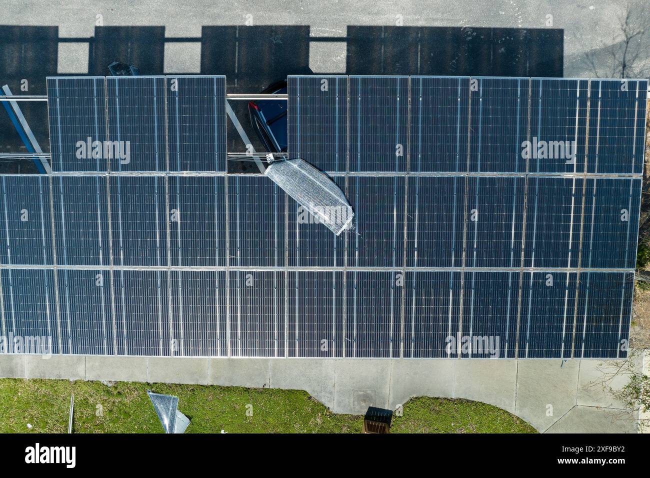 Hurricane wind damage to solar panels installed as shade roof over ...