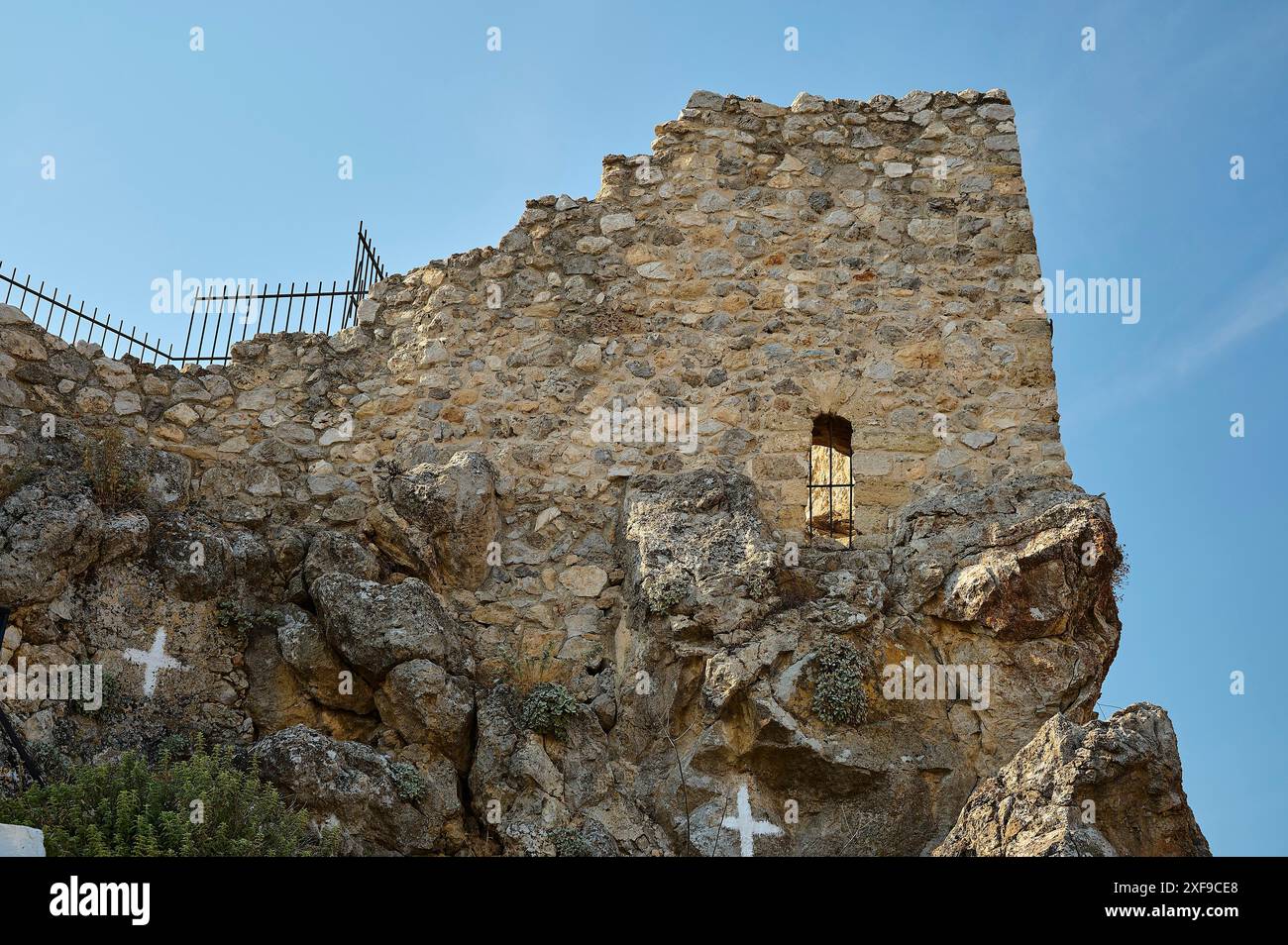 Historic stone wall with lattice and rocks, part of an ancient ruined ...