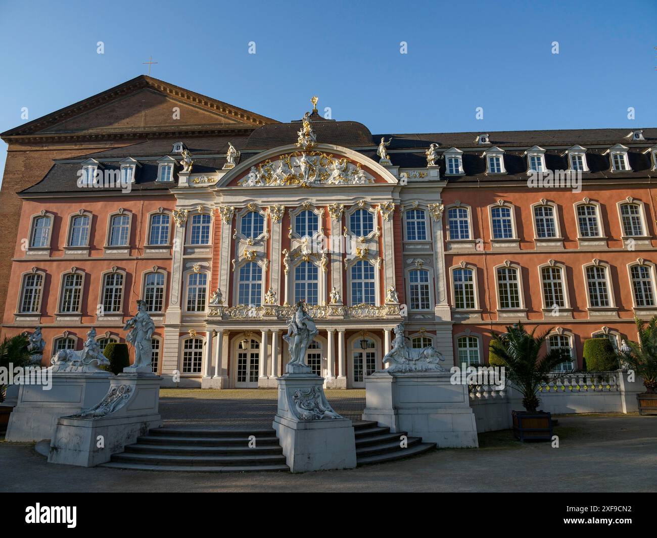 Front view of a magnificent palace with elaborate decorations, statues ...