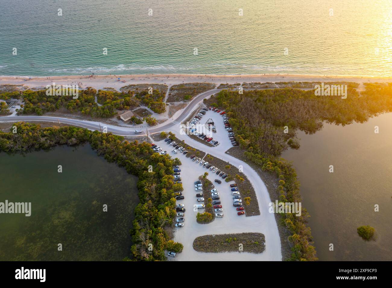 Parking lot at Florida Blind Pass beach on Manasota Key, USA. Vehicle ...