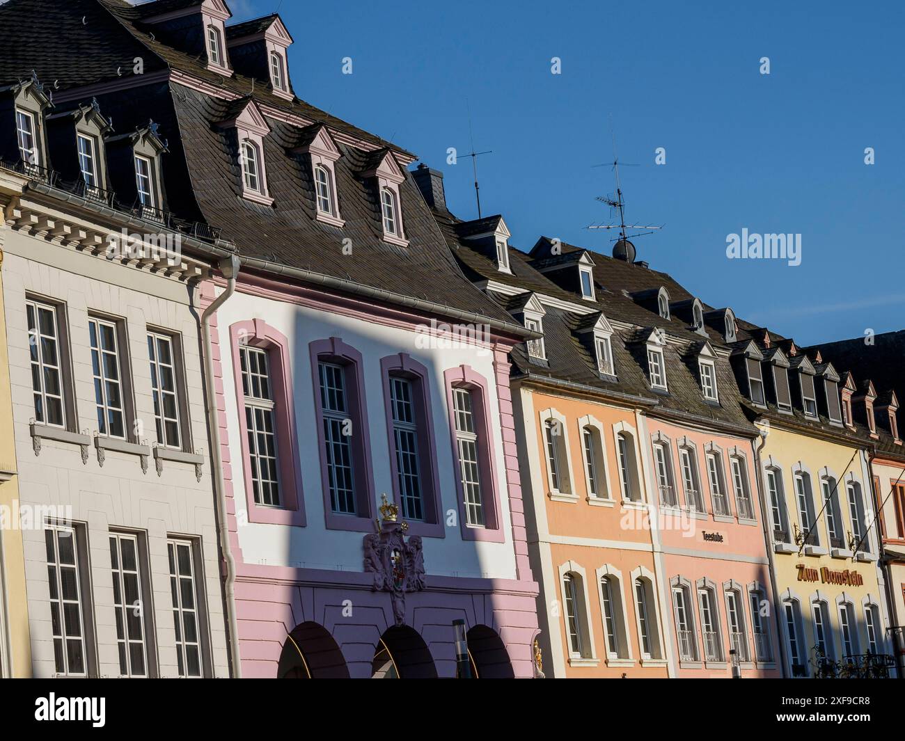 Beautiful houses with colourful facades and many windows under a clear ...